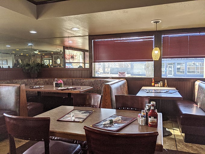 Cozy booths bathed in natural light create the perfect setting for lingering conversations. These aren't just dining spaces; they're memory-making machines.