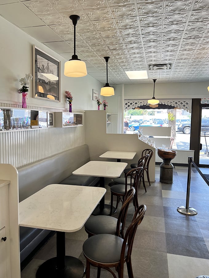 The classic ice cream parlor interior with its pressed tin ceiling and pendant lights feels like stepping into your sweetest childhood memory. 