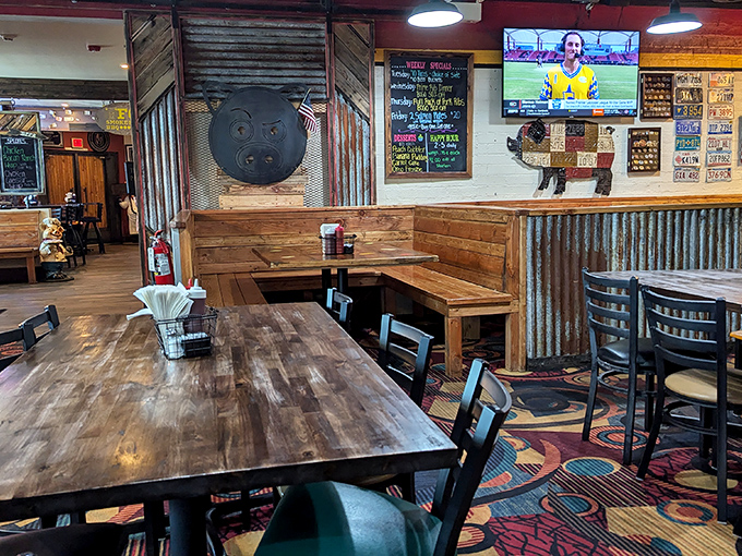 The dining room marries rustic charm with barbecue functionality&mdash;those wooden tables have witnessed more "food euphoria" moments than a cooking show highlight reel.