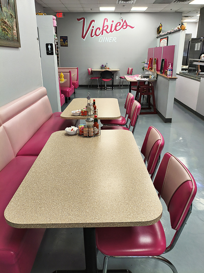 Pink seats, retro vibes, and a promise of deliciousness in the air. This dining area isn't just a room; it's a time machine with a side of awesome sauce.
