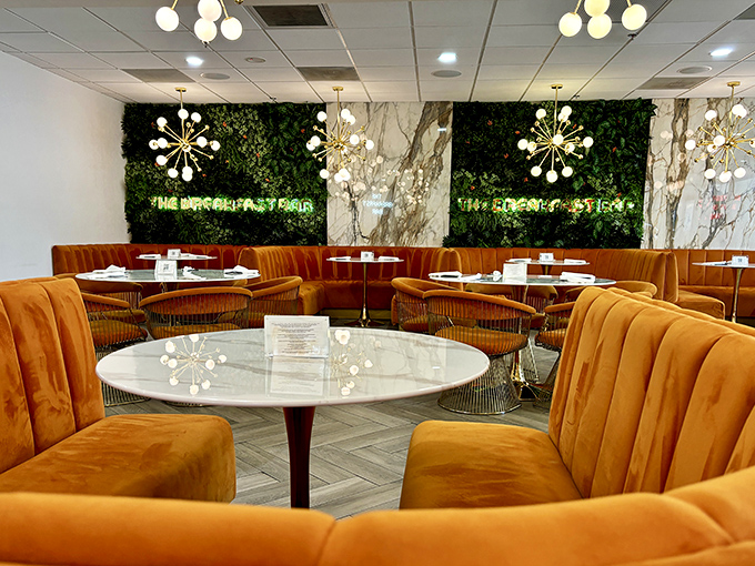 Orange velvet booths that cradle you like a breakfast-loving embrace, beneath chandeliers that look like the Jetsons went upscale.