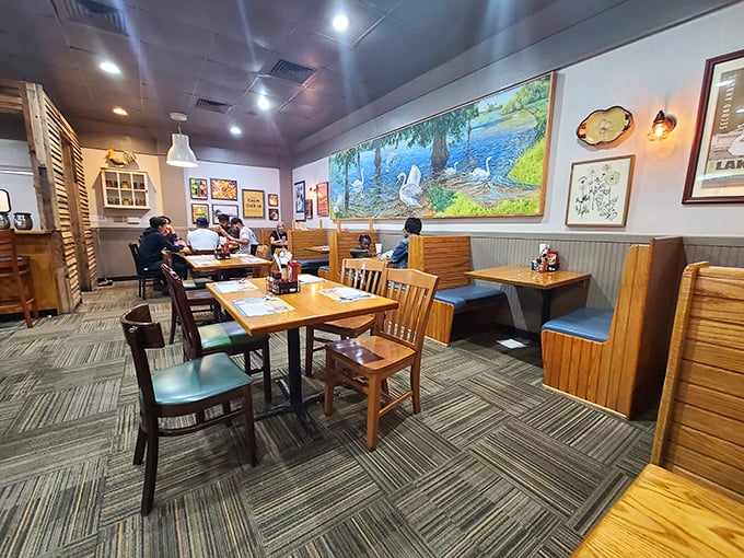 The dining area balances country charm with comfortable seating. That Florida wildlife mural says, "Yes, you're still in the Sunshine State."