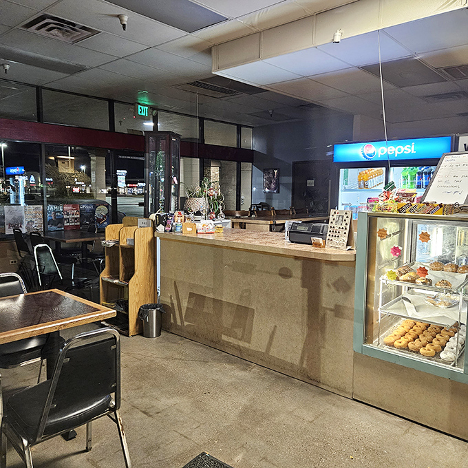 No-frills dining area where the food does all the talking. The counter speaks one universal language: fresh donuts await.