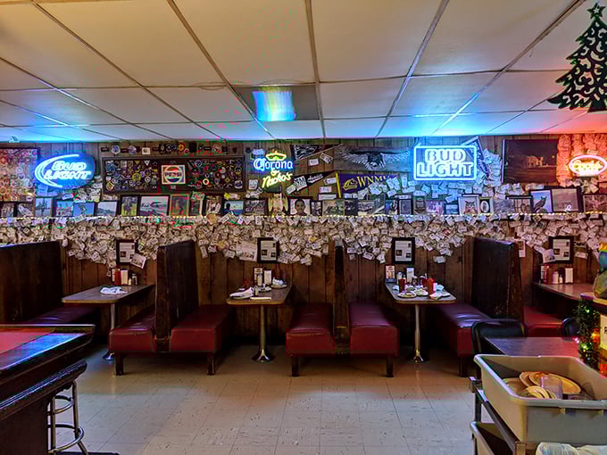 Red vinyl booths and walls plastered with memorabilia create the perfect backdrop for burger bliss. Every inch tells a story&mdash;most involving satisfied appetites.