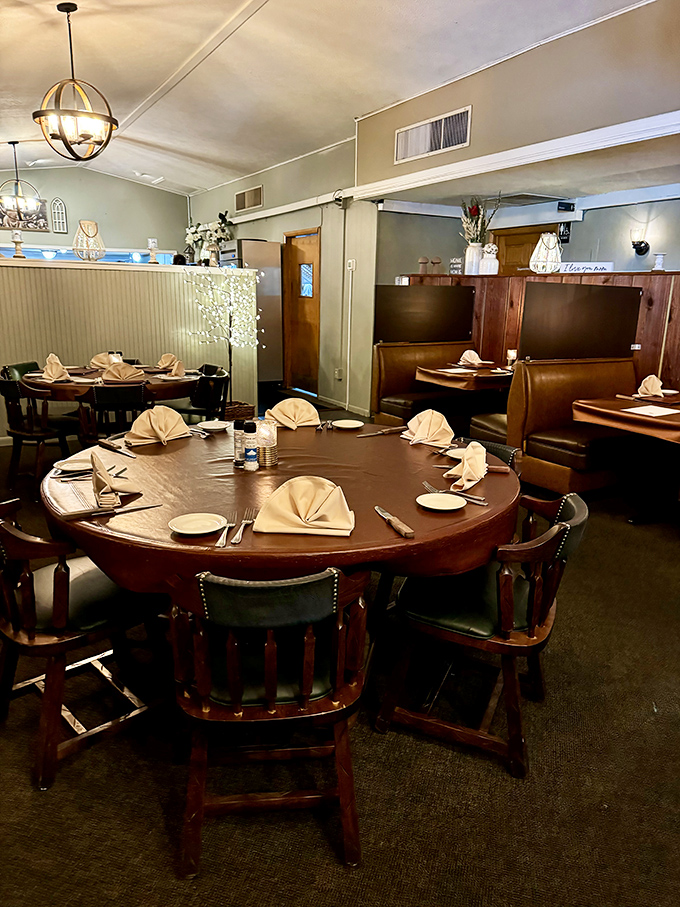 Round tables that encourage conversation and wooden chairs that say, "Stay awhile. Order dessert. Maybe another cocktail."