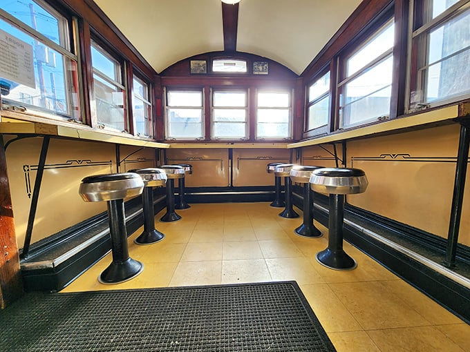 The dining car's yellow counters and vintage stools aren't retro by design—they're authentic by survival, a rare commodity these days.