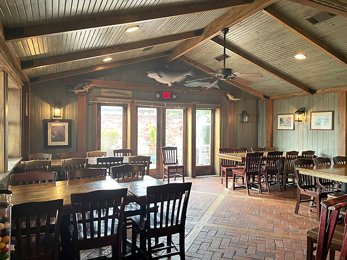 The dining room's vaulted wooden ceiling and brick floors create a space where time slows down just enough to savor every bite.