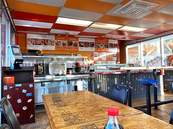 The dining area's colorful ceiling tiles and corrugated metal walls create an atmosphere that says, "We're serious about food, not about ourselves."