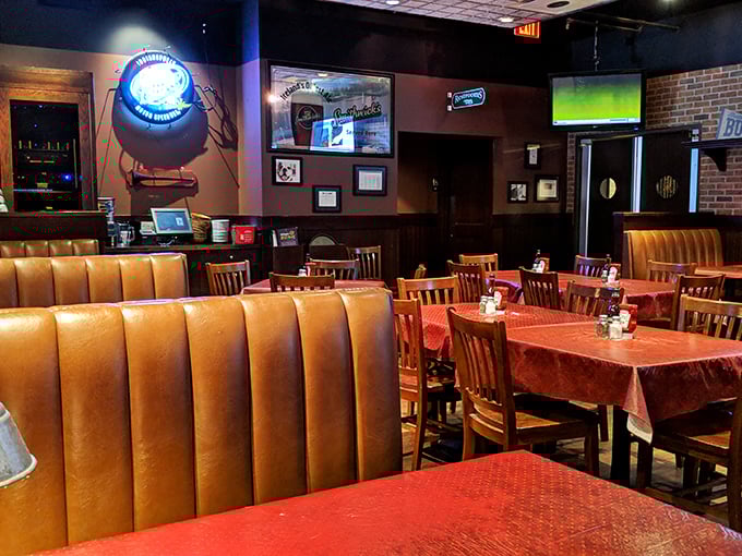 Those leather booths have heard more stories than a barber shop. The thoughtful layout creates intimate dining islands in a sea of conviviality.