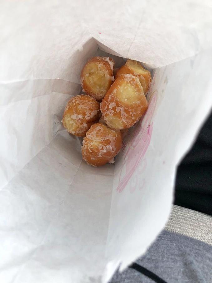 These pillowy donut holes prove that good things come in small packages—and in white paper bags that quickly develop translucent spots from fresh glaze.