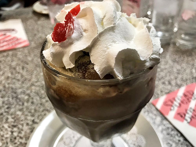 The Dusty Road Sundae—where chocolate and cream collide in a dessert so classic it should have its own commemorative postage stamp.