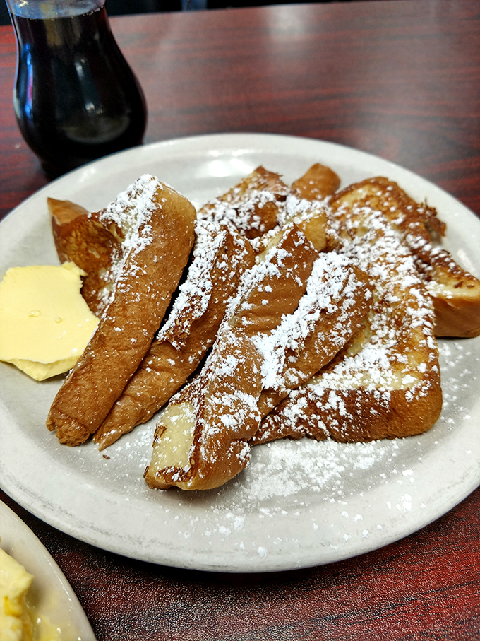 French toast that's been dipped, griddled, and dusted with powdered sugar &ndash; proof that bread can have a glorious second act. 