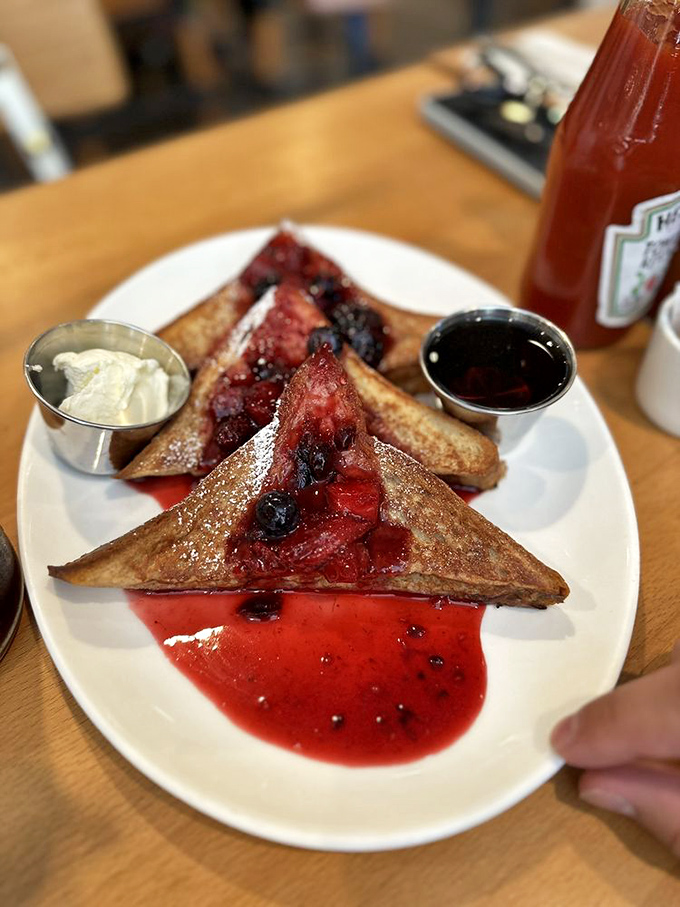 French toast swimming in berry compote that's so good you'll consider drinking the leftover sauce when no one's watching.