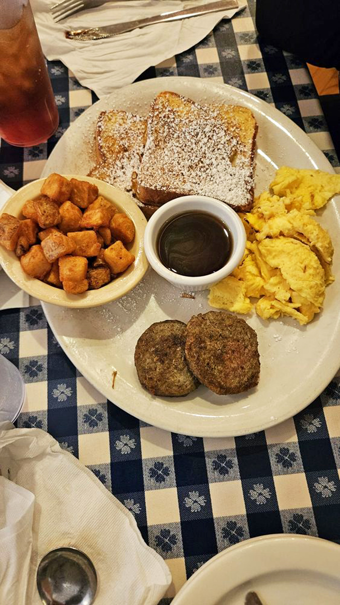 French toast that puts France to shame, dusted with powdered sugar like fresh Tennessee snow on a golden landscape.
