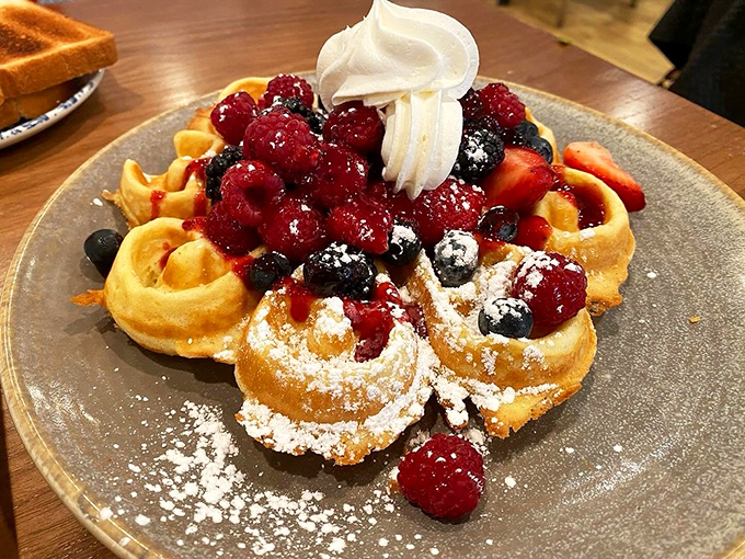 A waffle that's wearing all its jewelry &ndash; fresh berries, whipped cream, and powdered sugar create a breakfast that's dressed for success.