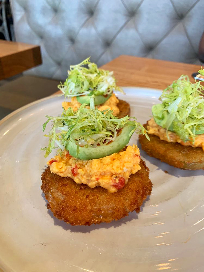 These aren't your average appetizers—they're Southern diplomats. Crispy fried green tomatoes topped with pimento cheese and microgreens speak universal deliciousness.