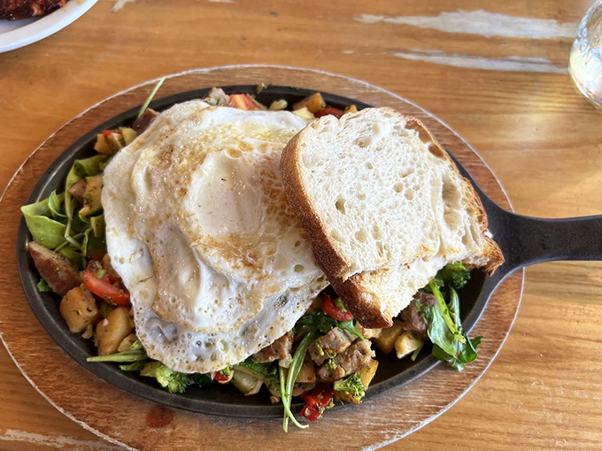Garden Hash with sausage&mdash;where veggies and meat unite in a cast-iron skillet of morning happiness beneath perfectly cooked eggs.