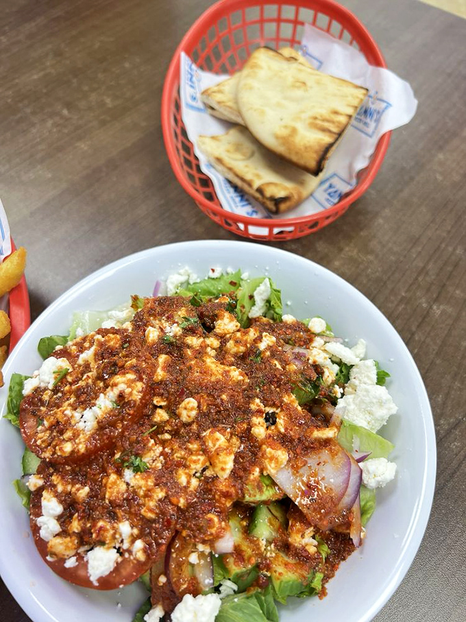 A proper Greek salad that respects tradition&mdash;chunky vegetables, substantial feta, and enough olive oil to make your cardiologist nervously check their calendar.