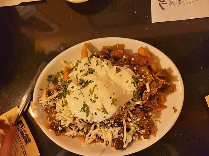Some restaurants hide behind fancy plating&mdash;The Mad Greek lets these pasta-topped fries with melted cheese and herbs speak their delicious truth.