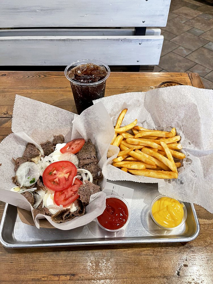 A tray that answers the eternal question: "What does happiness look like?" Turns out, it looks a lot like a gyro with fries and dipping sauces.