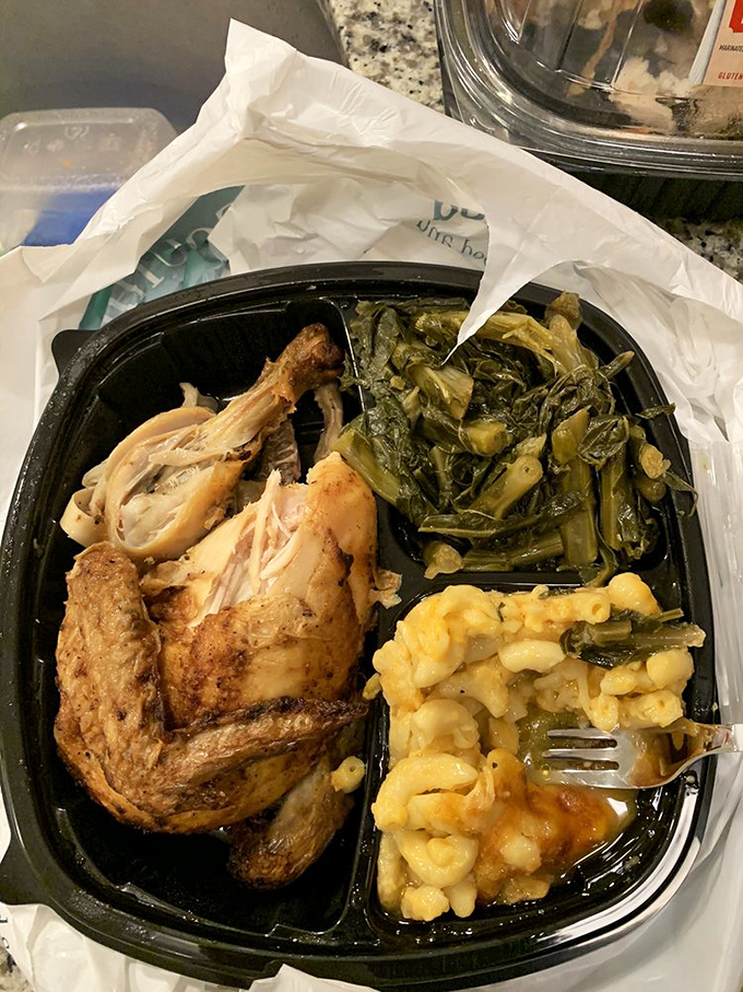 Half a chicken, perfectly seasoned, alongside greens and mac and cheese that make you wonder why you'd ever eat anything else.