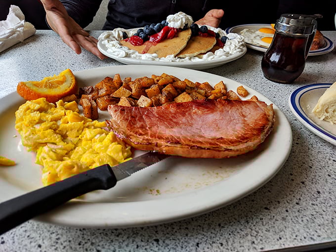 Breakfast of champions: ham steak so perfect it deserves its own fan club, paired with eggs that sunshine your plate regardless of Idaho's weather.