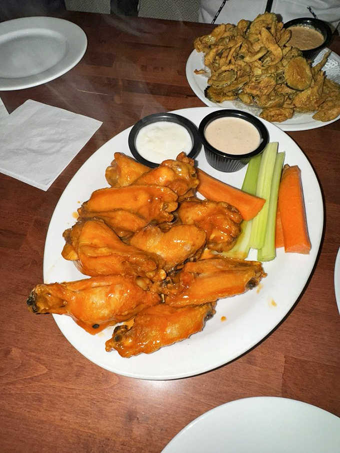 These buffalo wings aren't just orange&mdash;they're practically glowing with flavor, flanked by cooling celery and dipping sauces for the perfect bite. 