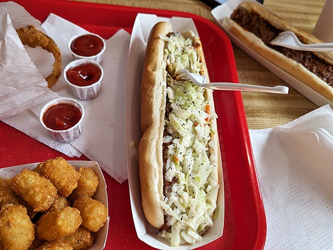 The hot dog, elevated to art form with a blanket of homestyle chili and slaw. Some food scholars call this Carolina's greatest contribution to civilization.