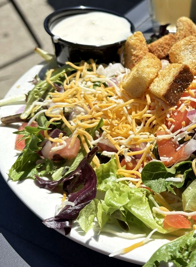 A house salad that actually deserves respect. Those crunchy croutons are the crown jewels in this garden of earthly delights.