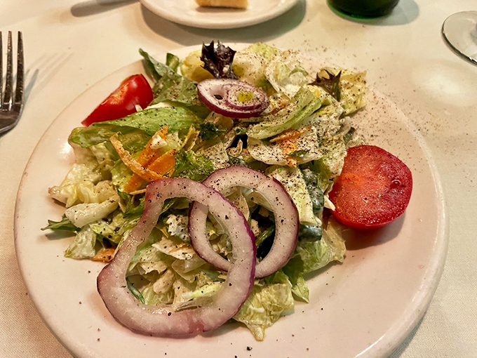 Even the house salad gets the royal treatment here—crisp, colorful, and clearly not an afterthought. A respectful prelude to the meaty main event.