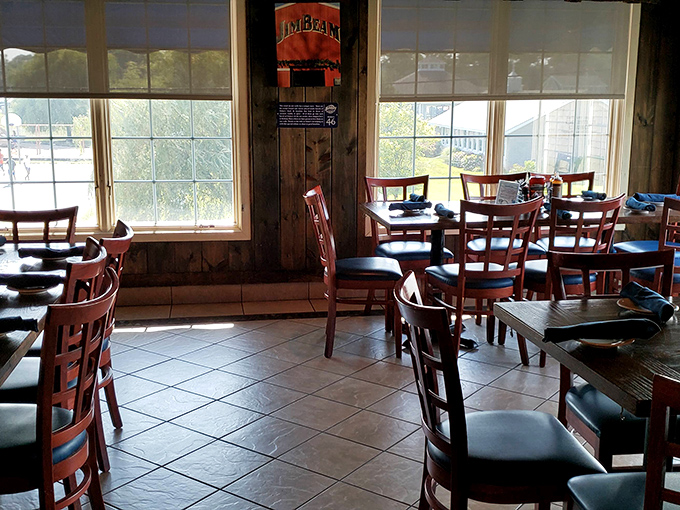 The sunlight streaming through windows transforms this dining room into a cathedral of comfort, where barbecue prayers are answered daily.