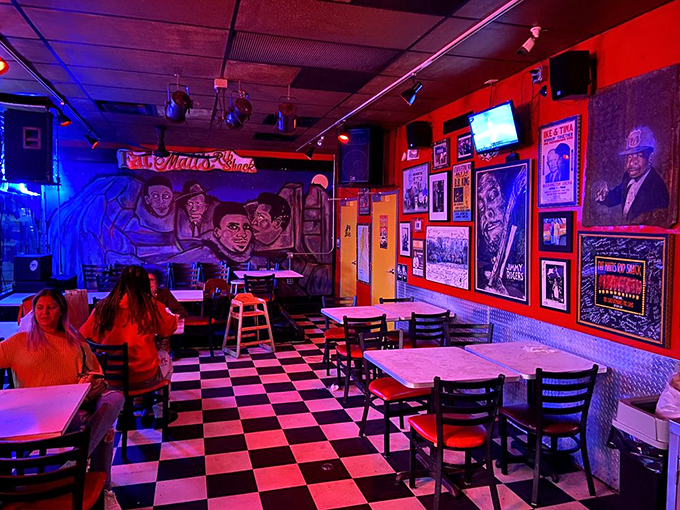 The checkered floor and blues memorabilia create the perfect backdrop for what's about to be the messiest, most satisfying meal of your week.