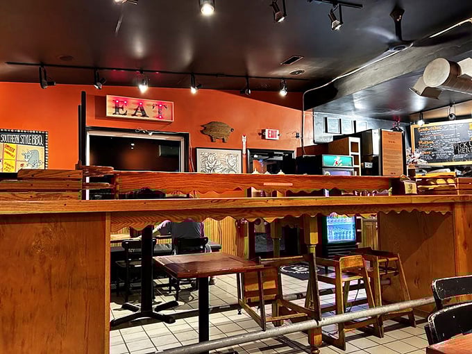 The warm orange walls and wooden accents create an atmosphere that says, "Stay awhile, your diet can restart tomorrow."