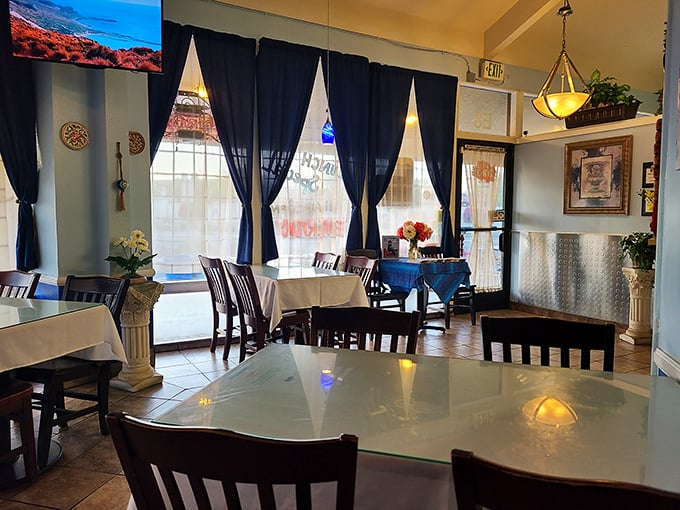 White tablecloths, blue curtains, and natural light create that "I've discovered a hidden gem" feeling that makes lunch feel like a mini-vacation.