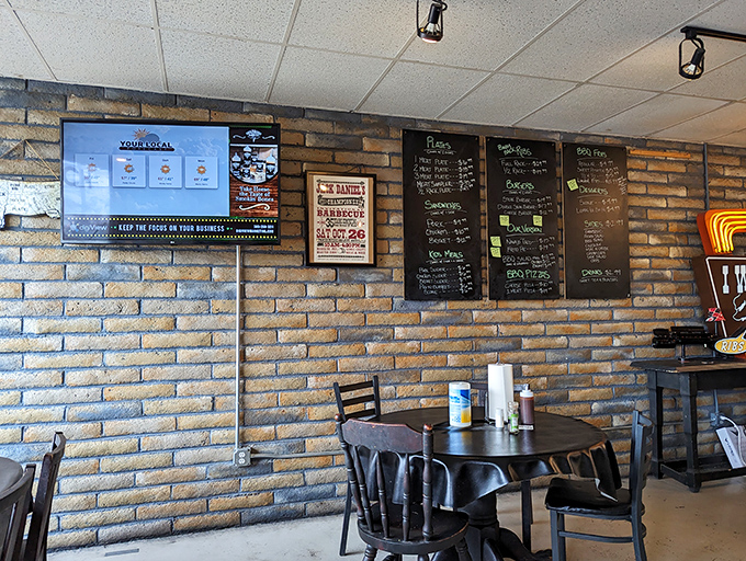 The brick walls have absorbed years of barbecue smoke and satisfied sighs, creating an atmosphere you can almost taste before your food arrives.