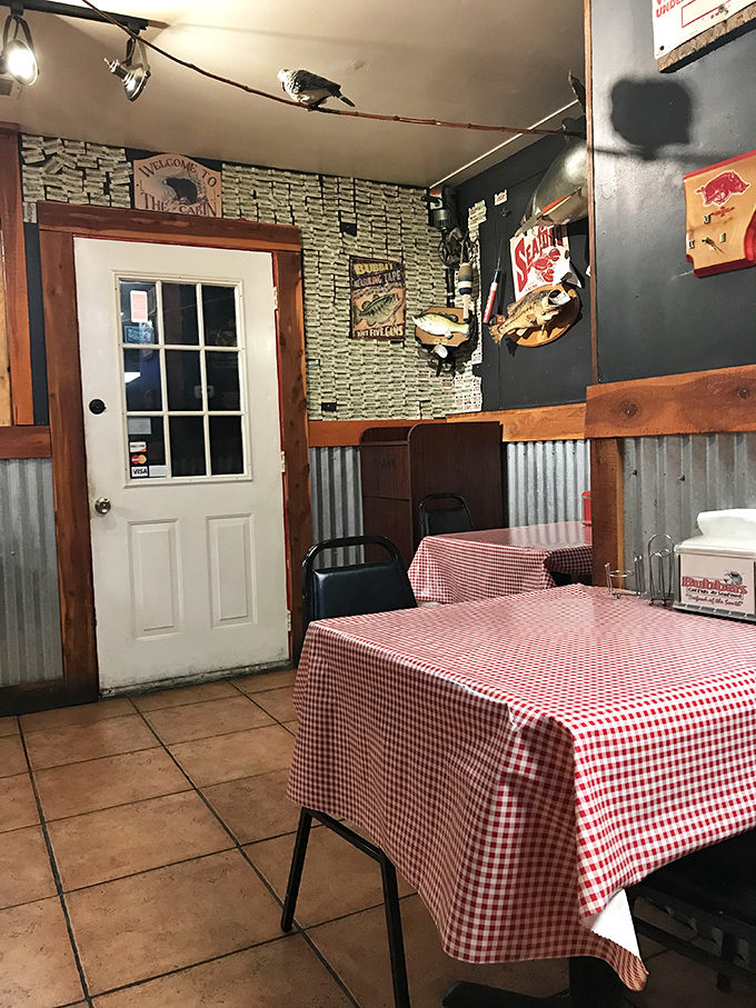 The stone-and-corrugated metal walls tell stories of countless satisfied diners who've discovered this unassuming seafood sanctuary.