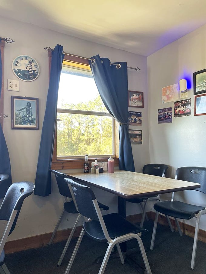 A cozy corner table with a view of Florida pines. The perfect spot to contemplate life's important questions, like "Should I order seconds?"