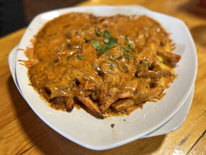 The ultimate diplomatic alliance: German cuisine meets gravy diplomacy. Tender meat surrenders to mushroom sauce alongside perfect sp&auml;tzle and sauerkraut.