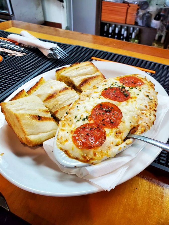 Pizza perfection with pepperoni that's curled into little cups of flavor. Those toasted garlic bread slices aren't just sides&mdash;they're sauce-delivery vehicles.