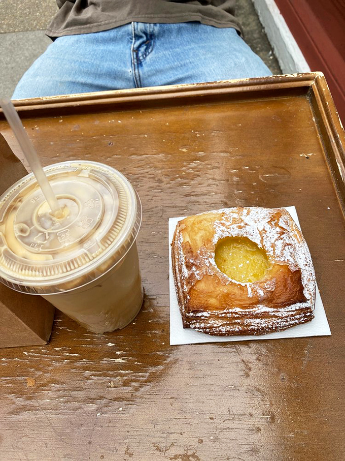 Coffee and lemon curd pastry: the breakfast power couple that makes Monday mornings slightly less offensive to humanity.