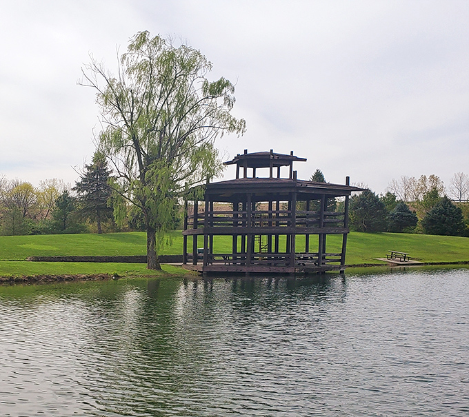 This peaceful gazebo at Mansfield Park offers a contemplative perch above still waters, proving that luxury isn't always about price tags.