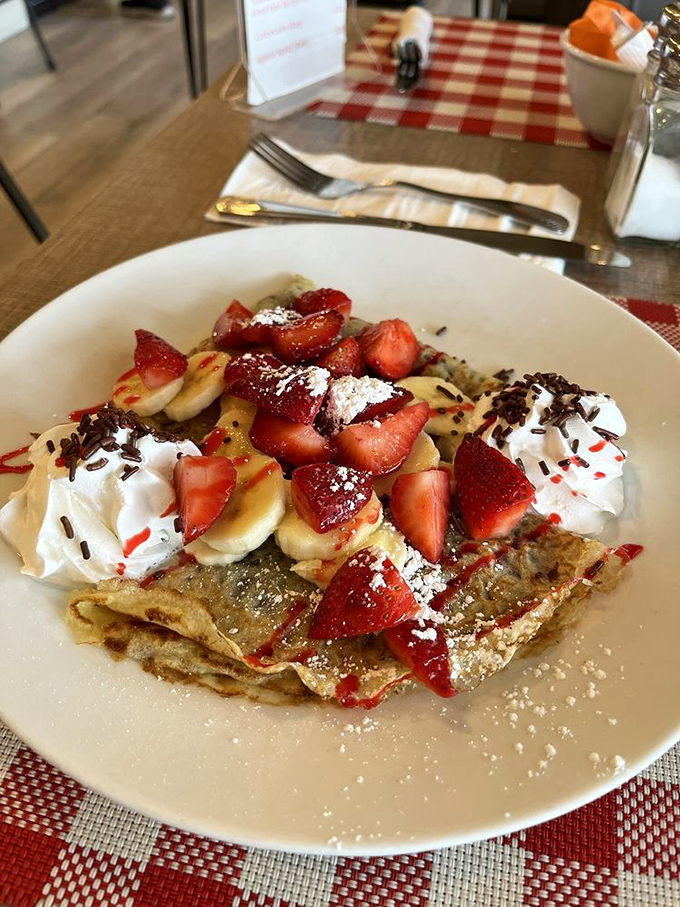 Crepes so perfectly topped with fresh fruit and cream, they make pancakes look like they're not even trying. Breakfast or dessert? Yes, please.