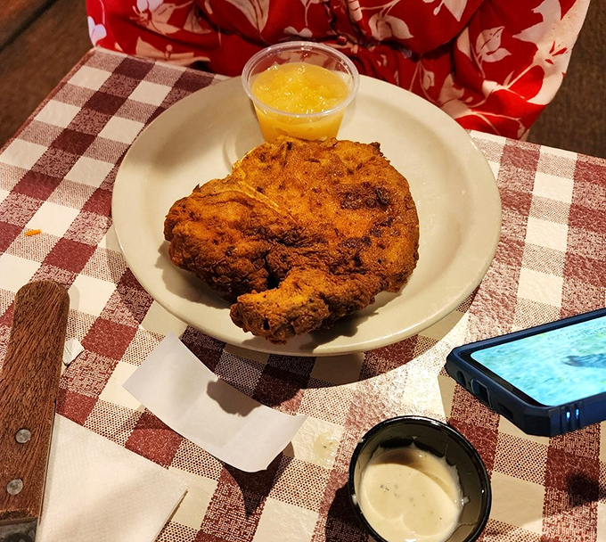 A pork chop that could make vegetarians question their life choices, served with applesauce that provides the perfect sweet counterpoint.