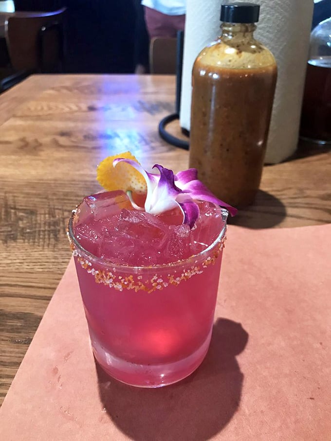 The prickly pear margarita: where Texas tradition meets cocktail artistry. That vibrant color isn't just for show&mdash;it's a promise of refreshment.