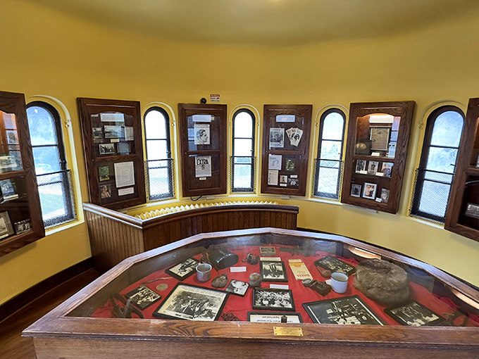 Vintage photographs and personal items tell the story of a man who turned his passion for storytelling into a yellow castle on a Michigan riverbank.