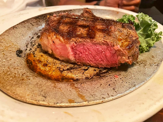 This ribeye isn't just cooked&mdash;it's been treated with the reverence of a sacred text, its perfect medium-rare interior revealing beef scripture.