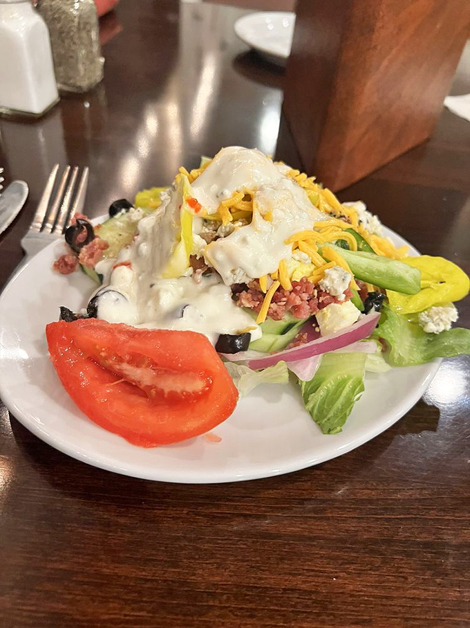 A salad that's actually trying&mdash;loaded with cheese, veggies, and enough toppings to make you momentarily forget about the prime rib. Almost.