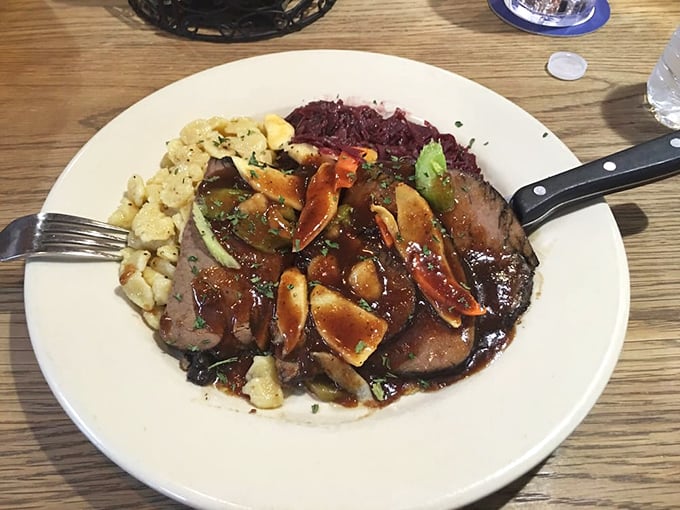 Sauerbraten with red cabbage&mdash;a plate where sweet meets sour in perfect harmony, like a culinary yin and yang with German precision.