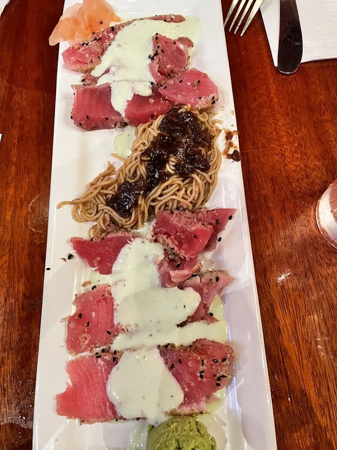 Seared tuna that's dressed better than most people at a fancy wedding. That rare center is the culinary equivalent of finding a unicorn.