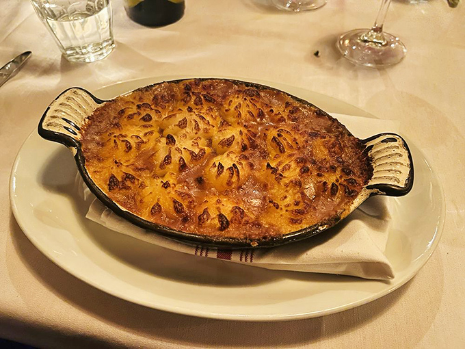This golden-topped gratin would make a French grandmother nod in silent approval—comfort food that's traveled across an ocean but feels like home.